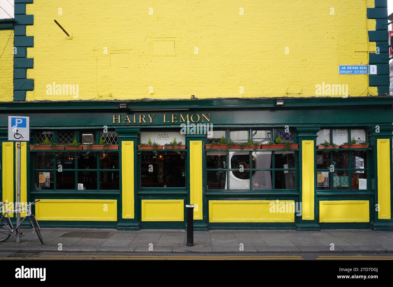 Dublin pub in building with brick painted lemon yellow Stock Photo - Alamy