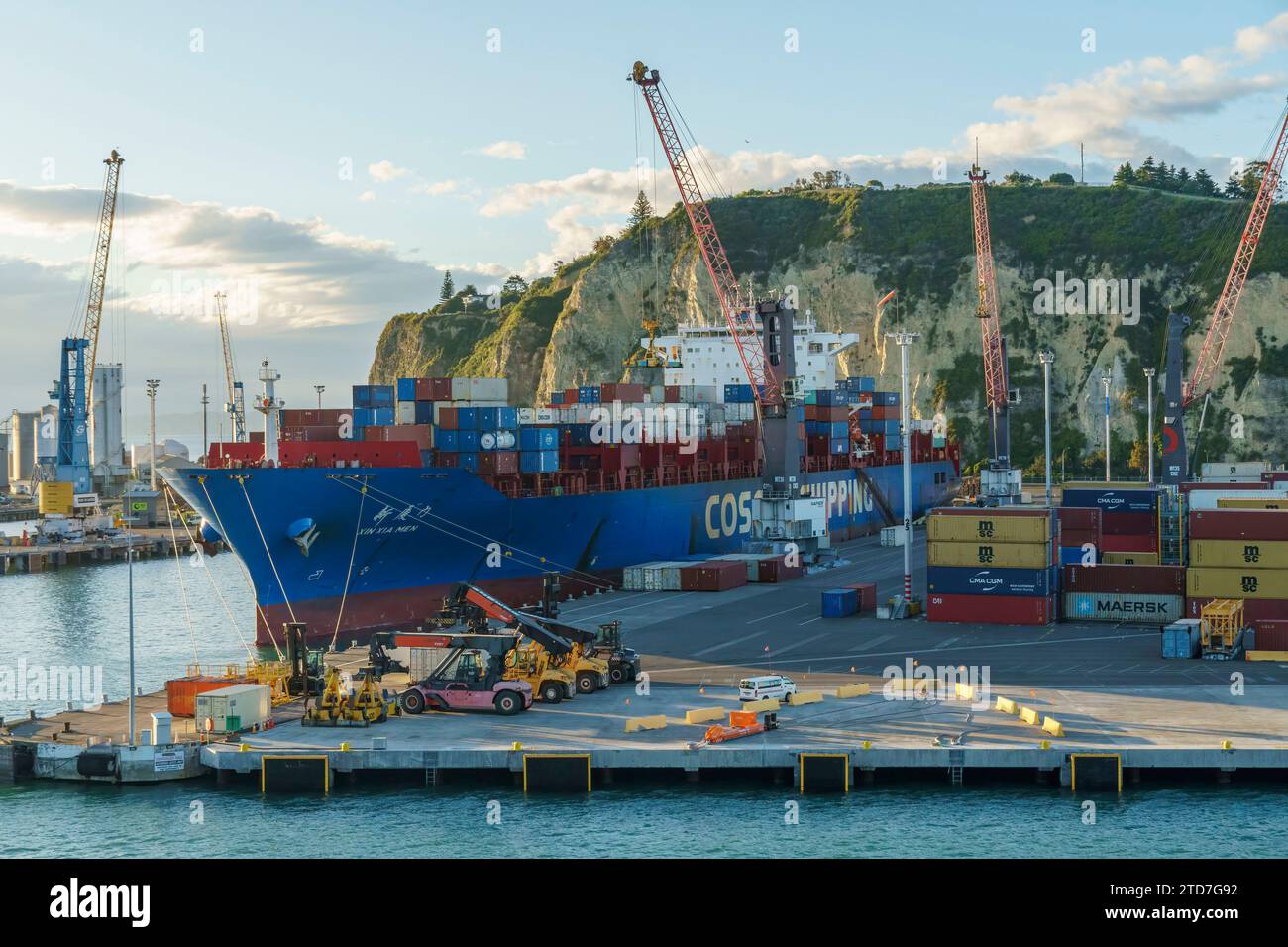 The COSCO container ship XIN XIA MEN unloading at Napier, NZ Stock ...