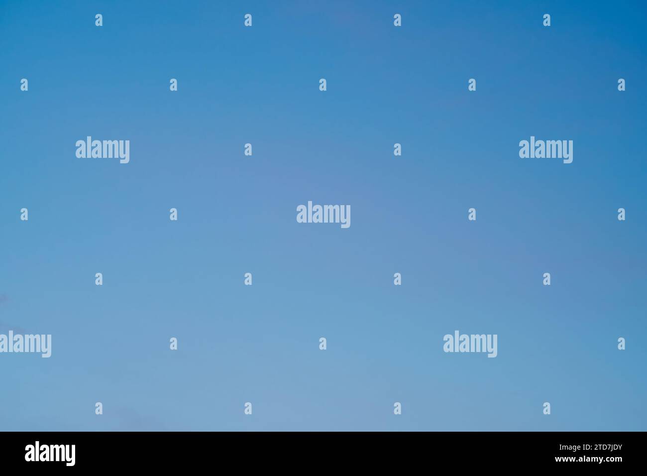 Blue sky with shades of pink from the setting sun Stock Photo - Alamy