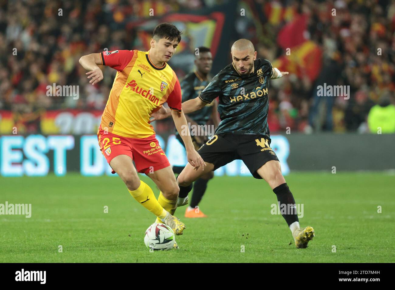 Abdukodir Khusanov of Lens, Teddy Teuma of Reims during the French ...