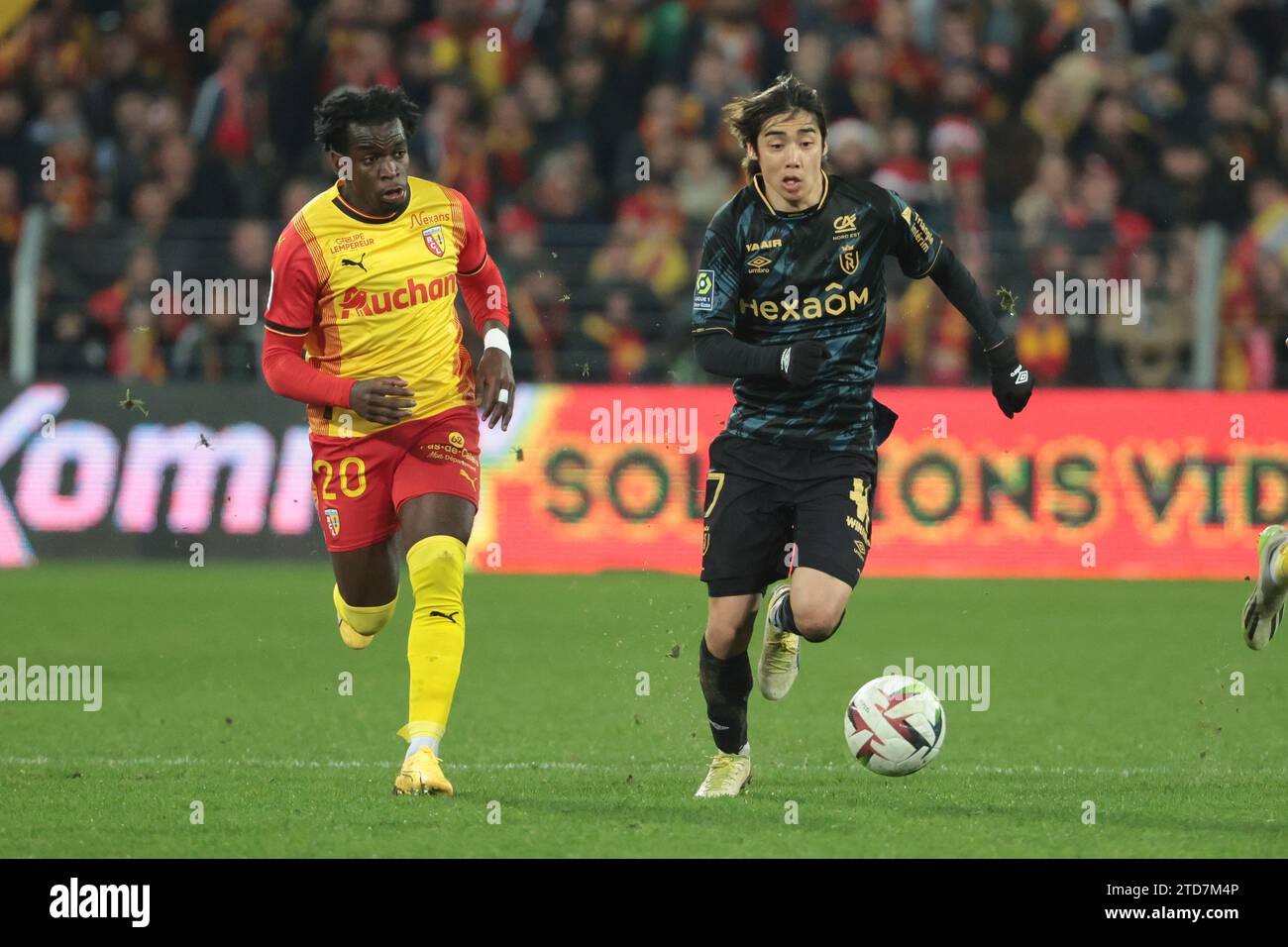 Junya Ito of Reims, left Faitout Maouassa of Lens during the French ...
