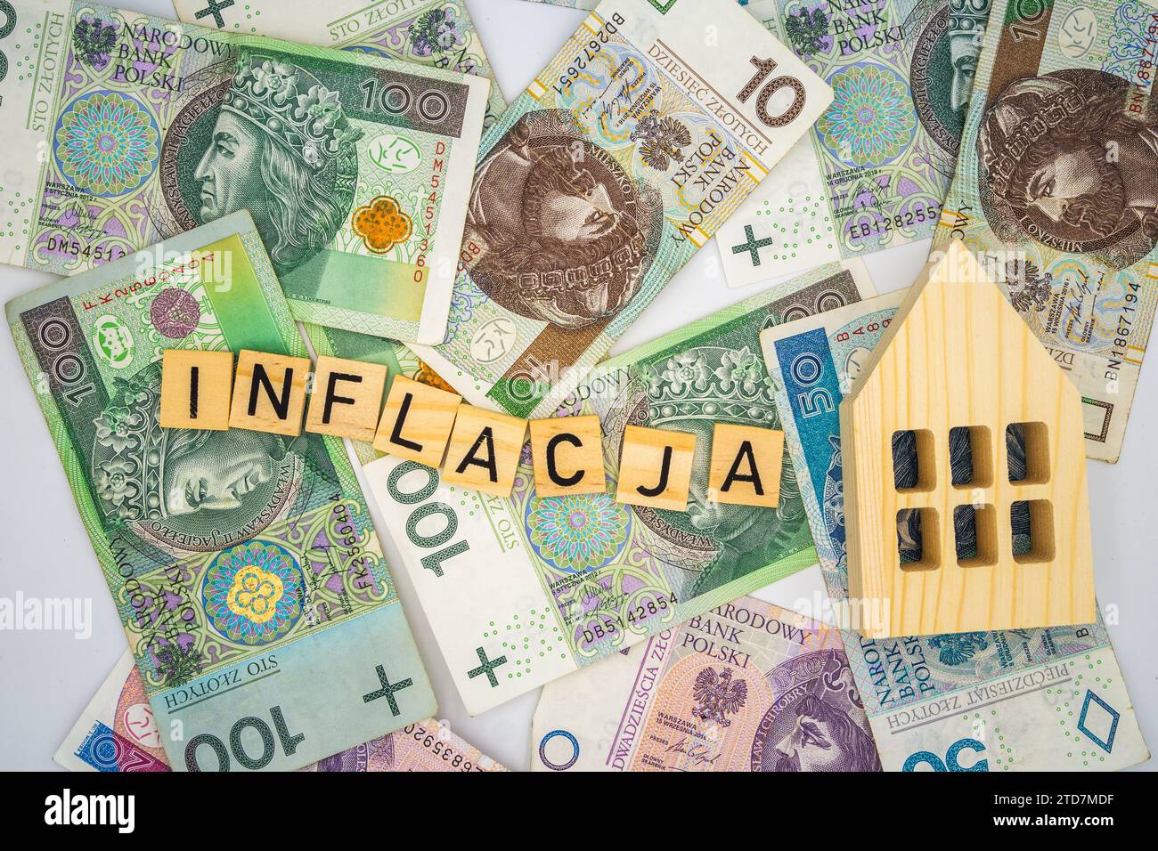 Polish word "inflacja" inflation with wooden house Polish zloty ...