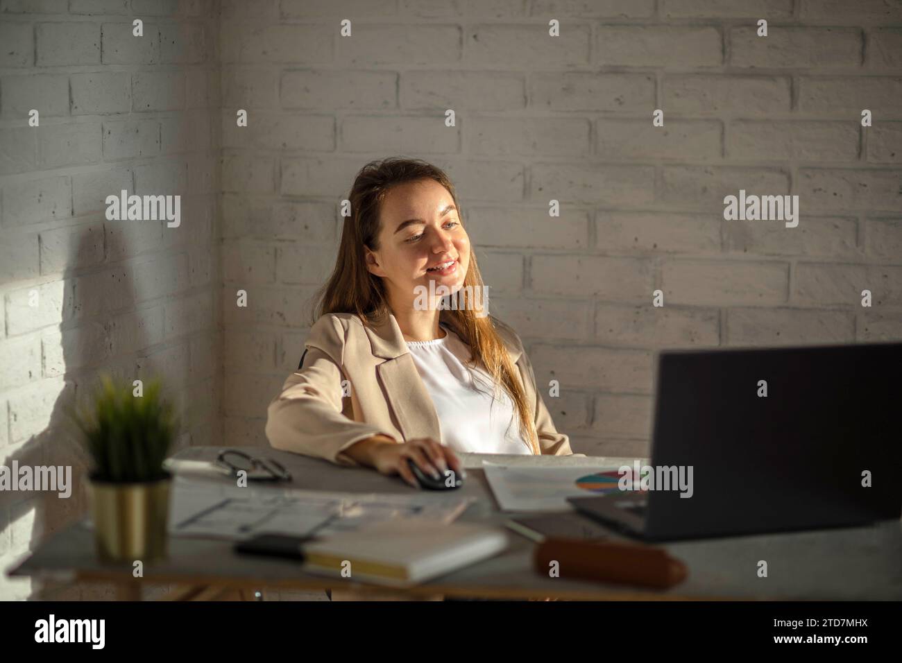 Young woman Calculating Success: Hands-on Strategies for Office ...