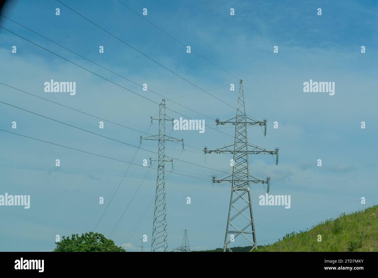 High voltage towers with sky background. Power line support with wires ...
