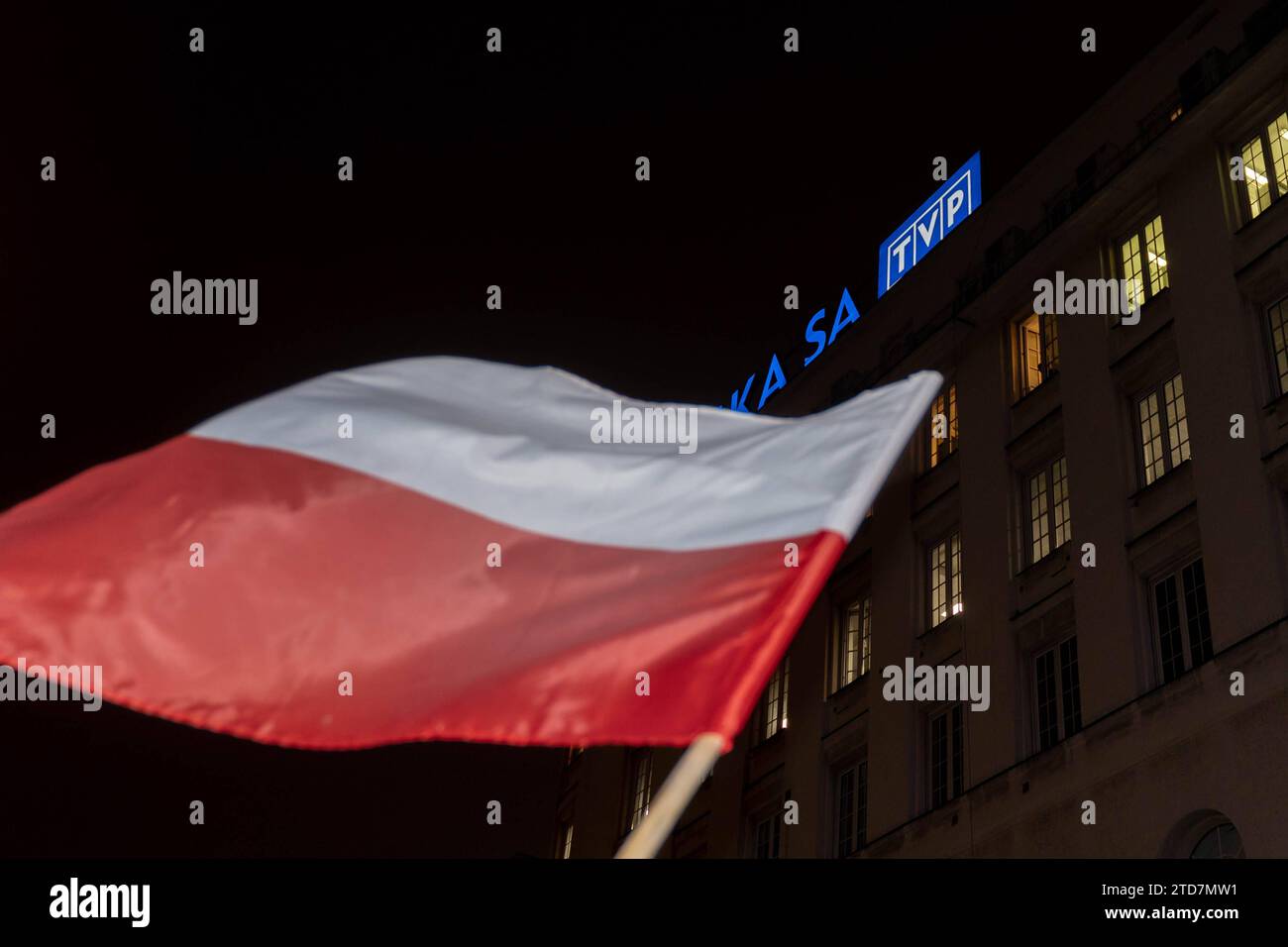 a waving Polish flag and the Polish Television TVP logo in the ...