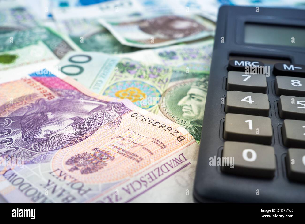 lose up on a Calculator accounting concept Polish zloty banknote ...