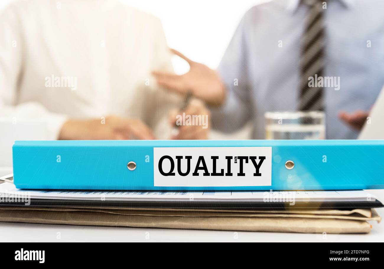 Quality Management documents in meeting room with the team discussing ...