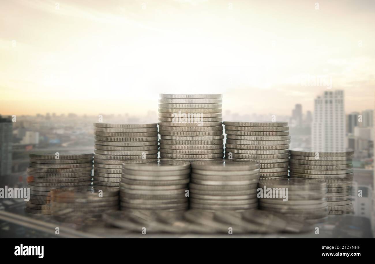 finance and value money growth concept. coins stack diagram with city ...