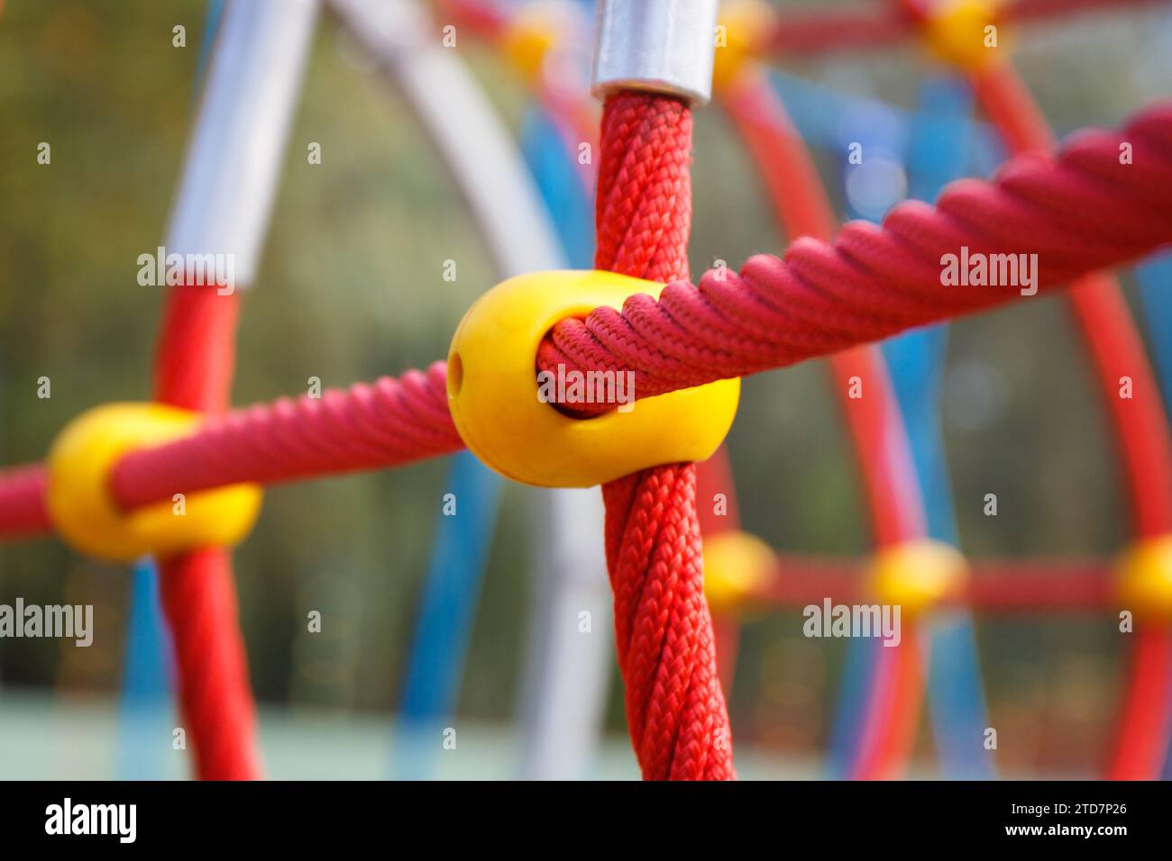 Red rope as mesh for climbing on playground. Kids play and sport Stock ...