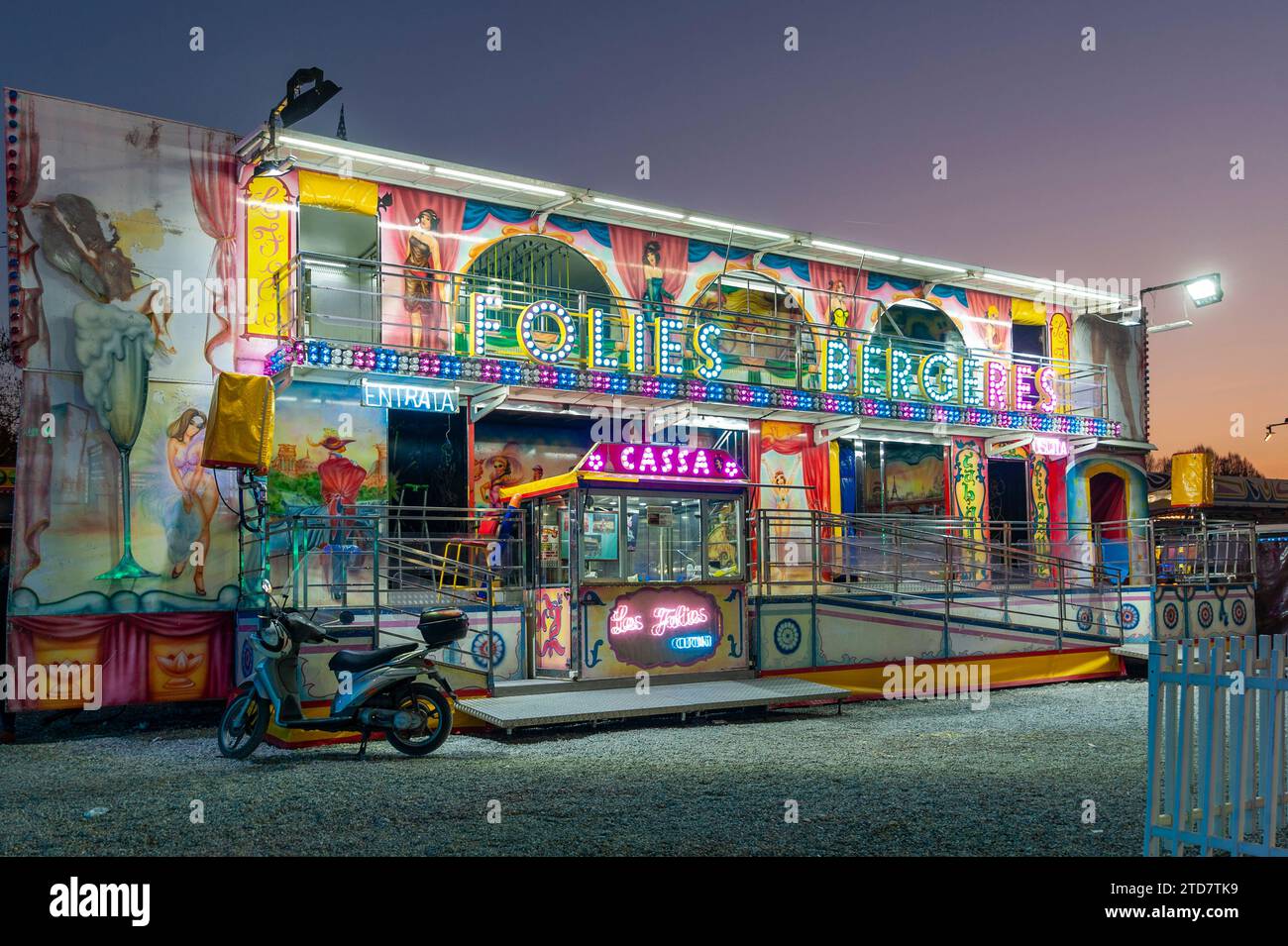 View, panorama of funfair, amusement park at night with vivid lights ...