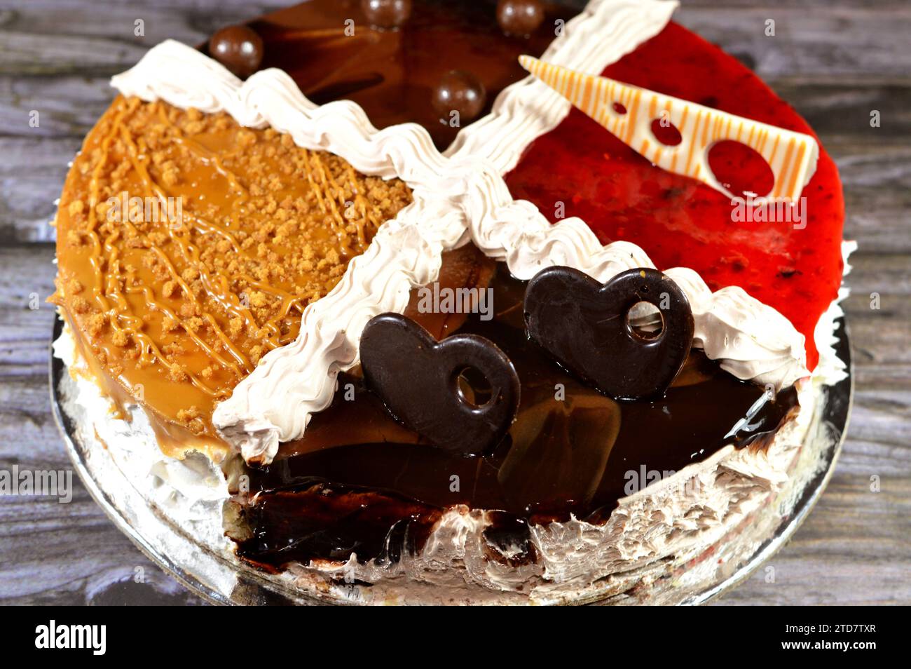 A birthday cake, four different quarters spongy creamy cake for ...