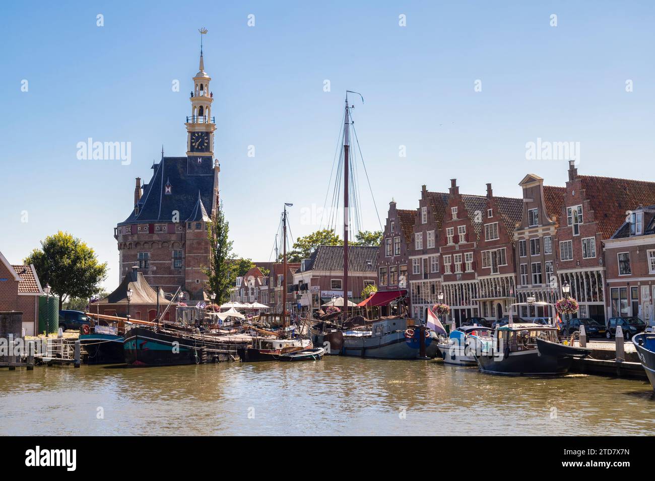 Historic Hoofdtoren tower and row of houses in the old harbour of the ...