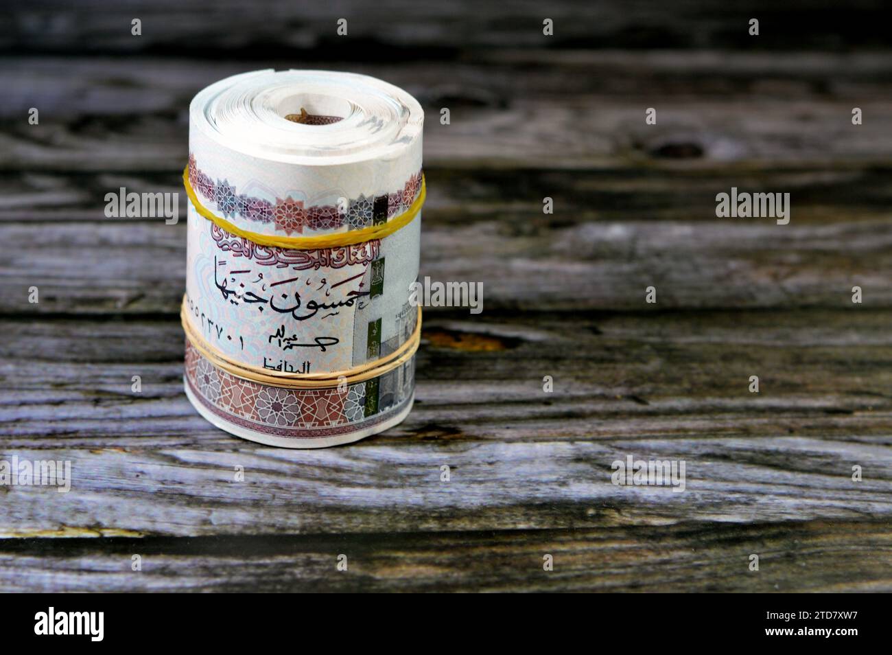 Egypt money roll pounds isolated on wood background, 50 LE fifty ...