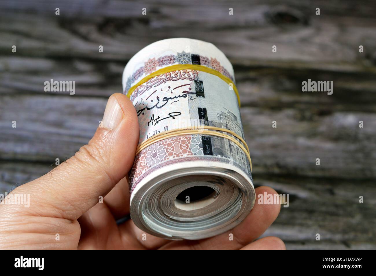 Egypt money roll pounds isolated on wood background, 50 LE fifty ...