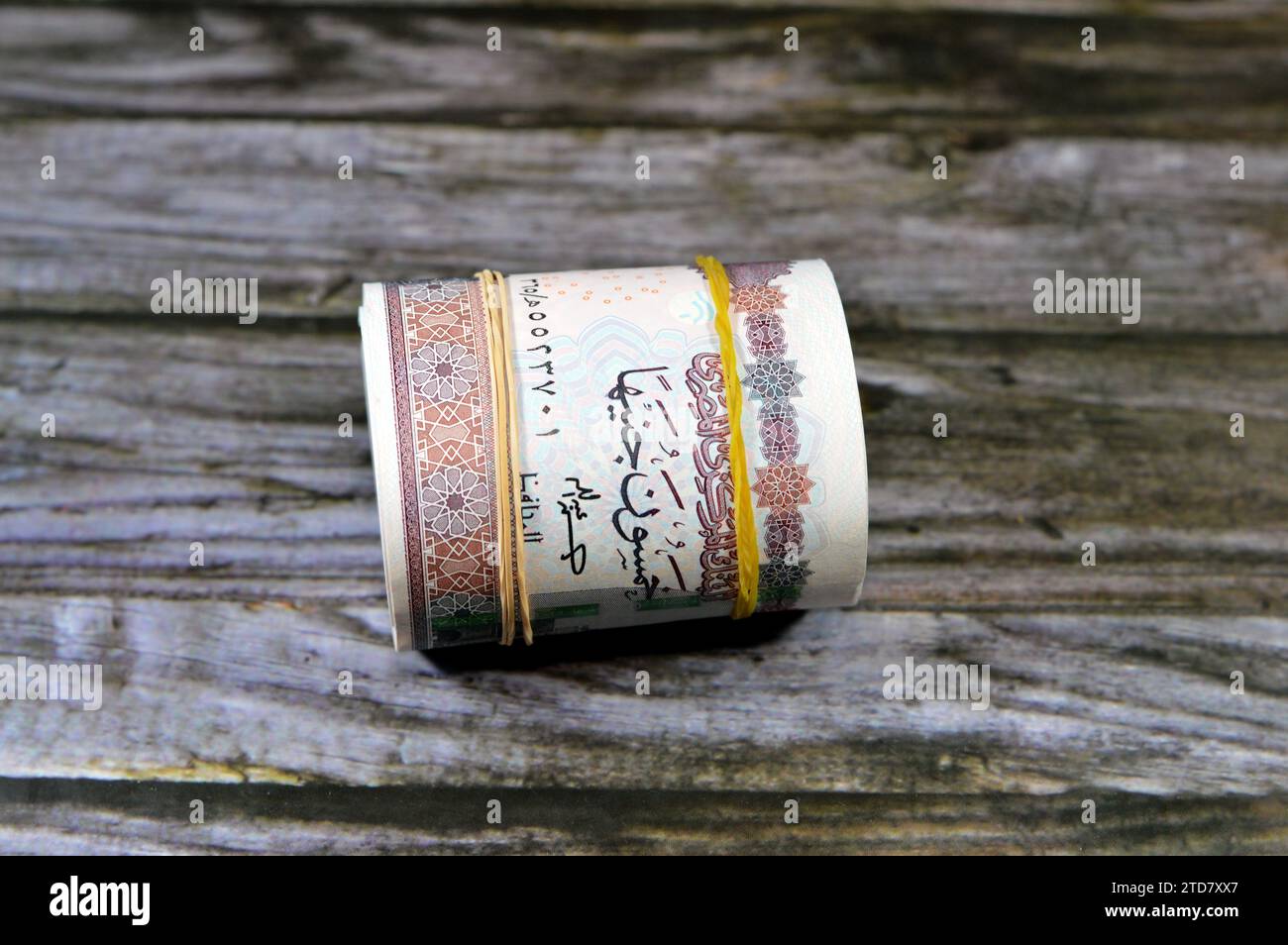 Egypt money roll pounds isolated on wood background, 50 LE fifty ...
