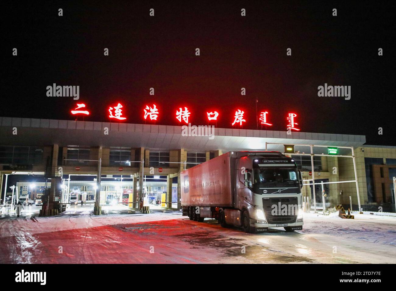 Erenhot. 16th Dec, 2023. A cargo vehicle passes the highway port of ...