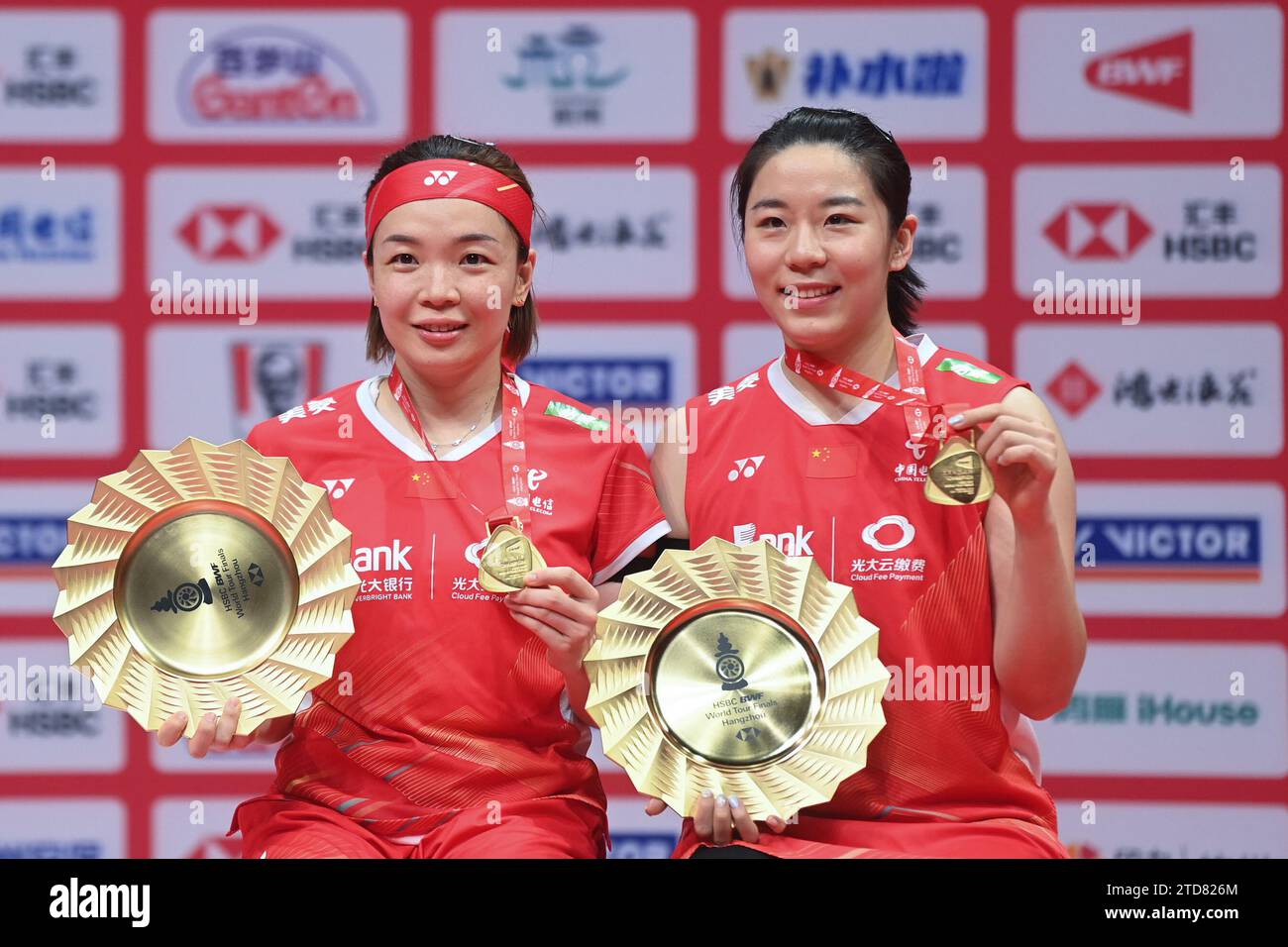 Hangzhou. 17th Dec, 2023. Gold medalists Chen Qingchen (L)/Jia Yifan pose during the awarding ...