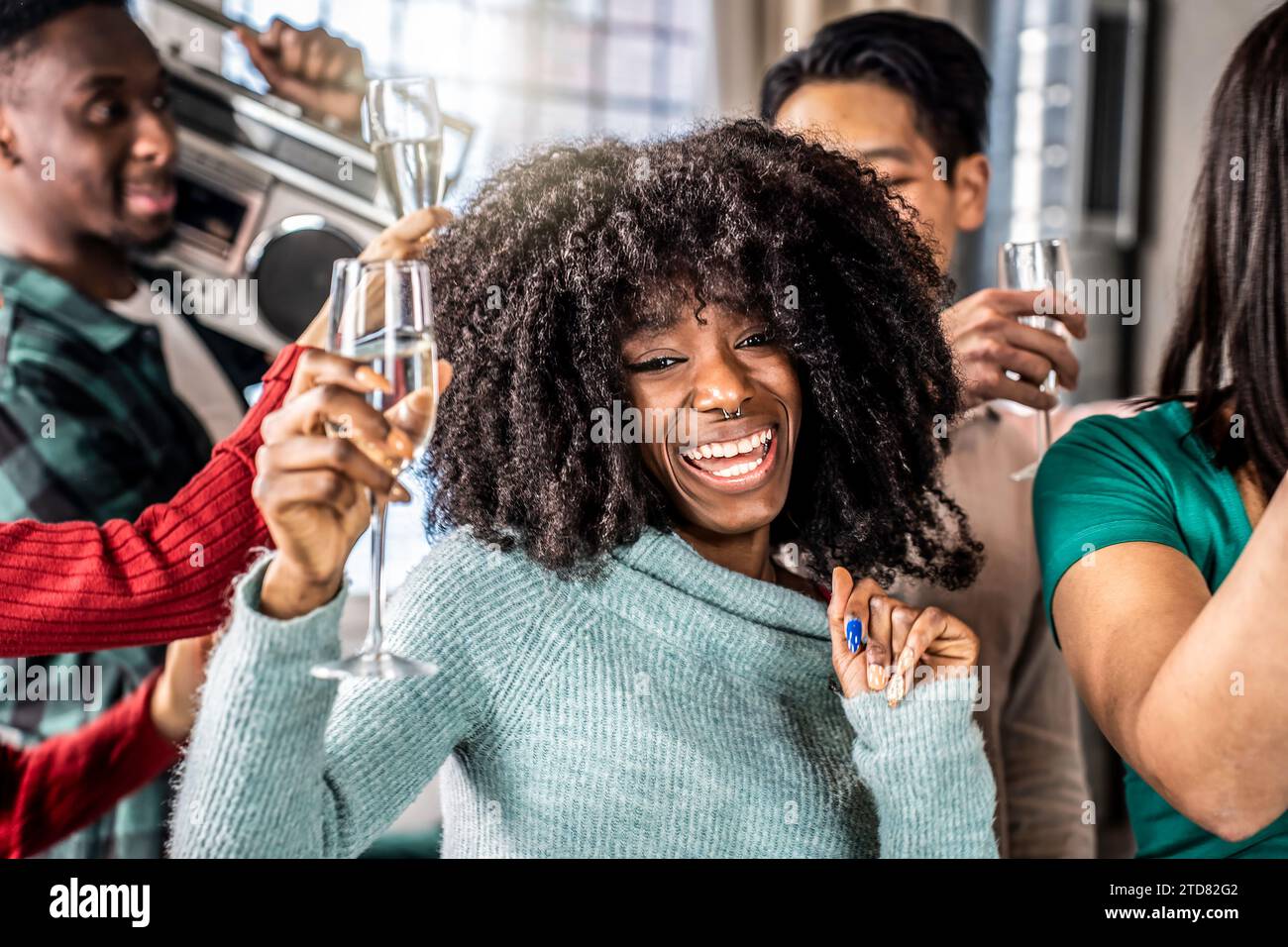 Multi ethnic young friends having home party together - Funny diverse ...