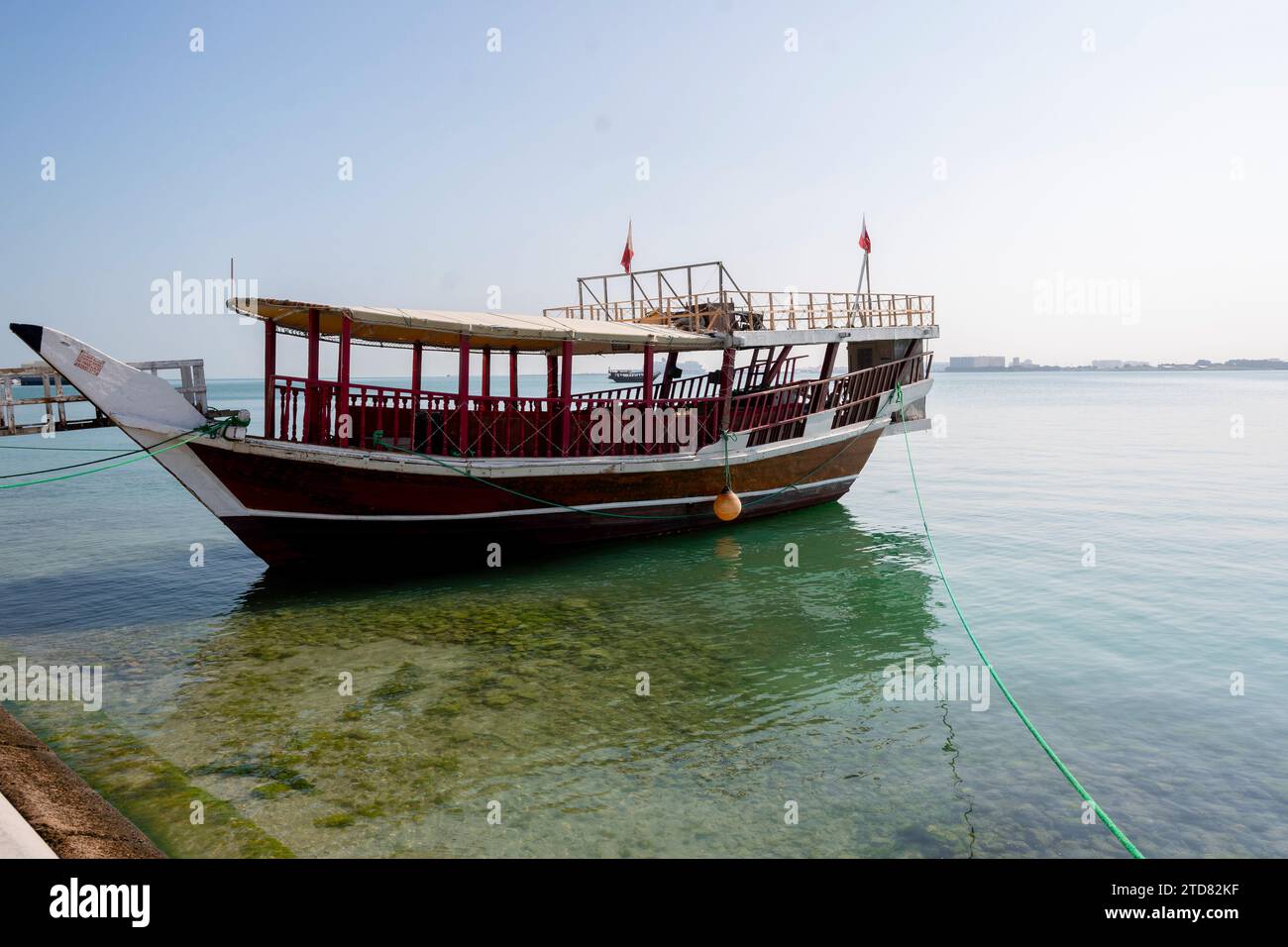 Traditional dhow on a background of a modern city of West Bay Doha, Qa ...