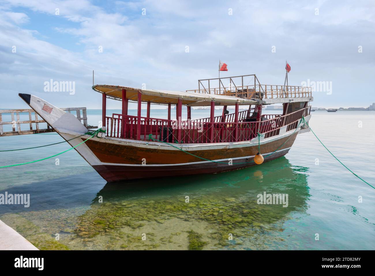Traditional dhow on a background of a modern city of West Bay Doha, Qa ...