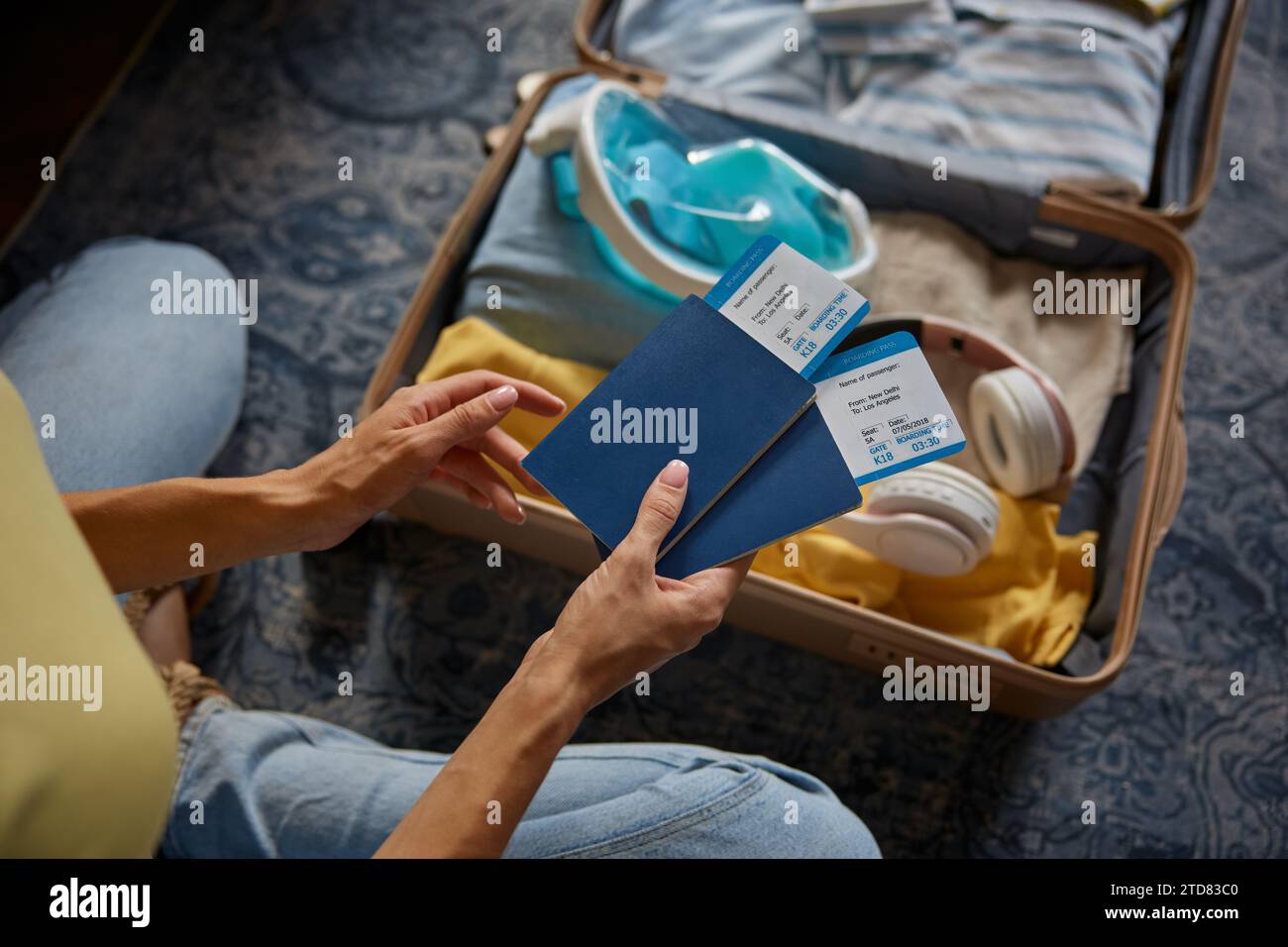 Closeup woman holding travel ticket with boarding pass and passport ...