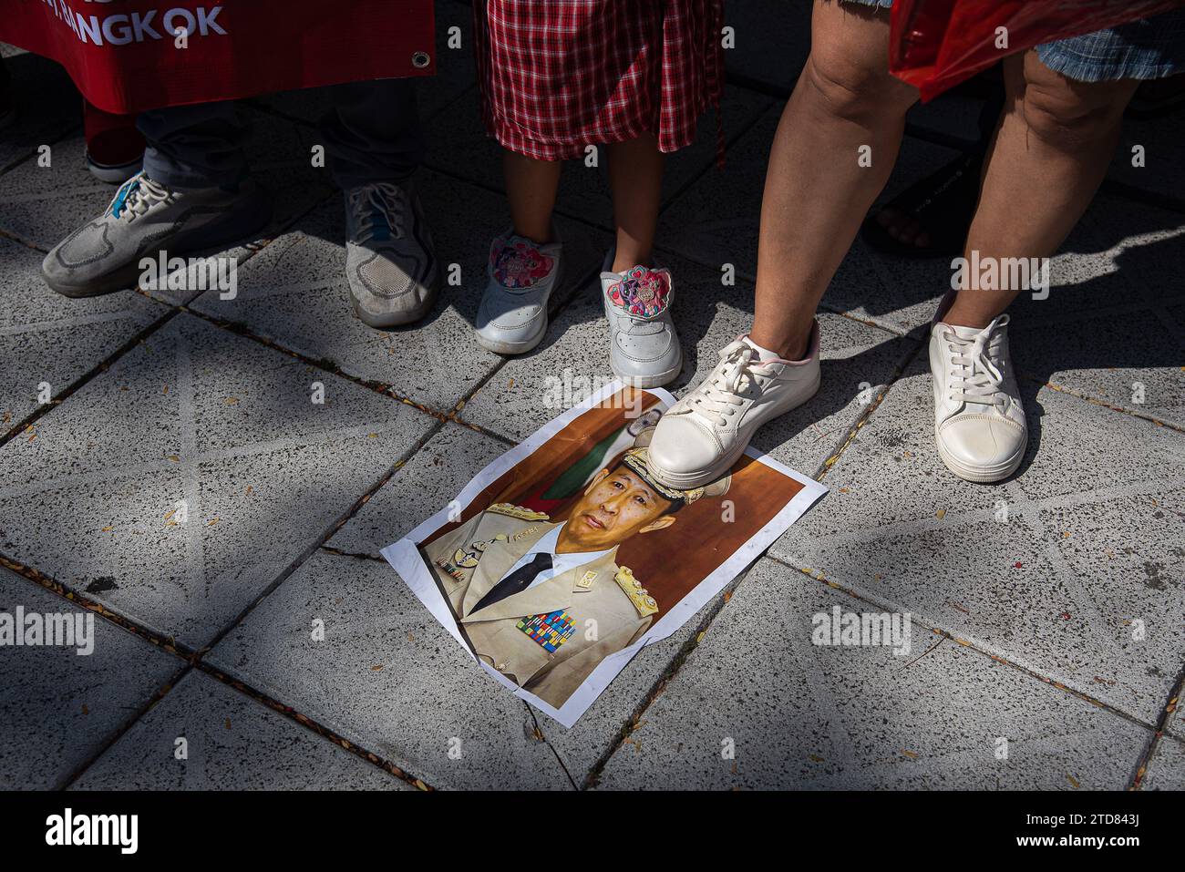 Bangkok, Thailand. 17th Dec, 2023. Protesters step on a portrait of ...