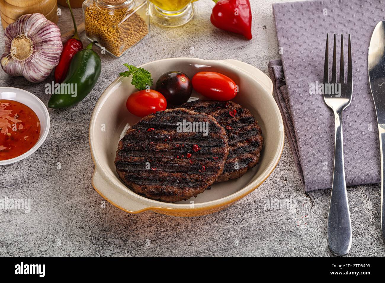 Grilled beef burger cutlet with sauce Stock Photo - Alamy