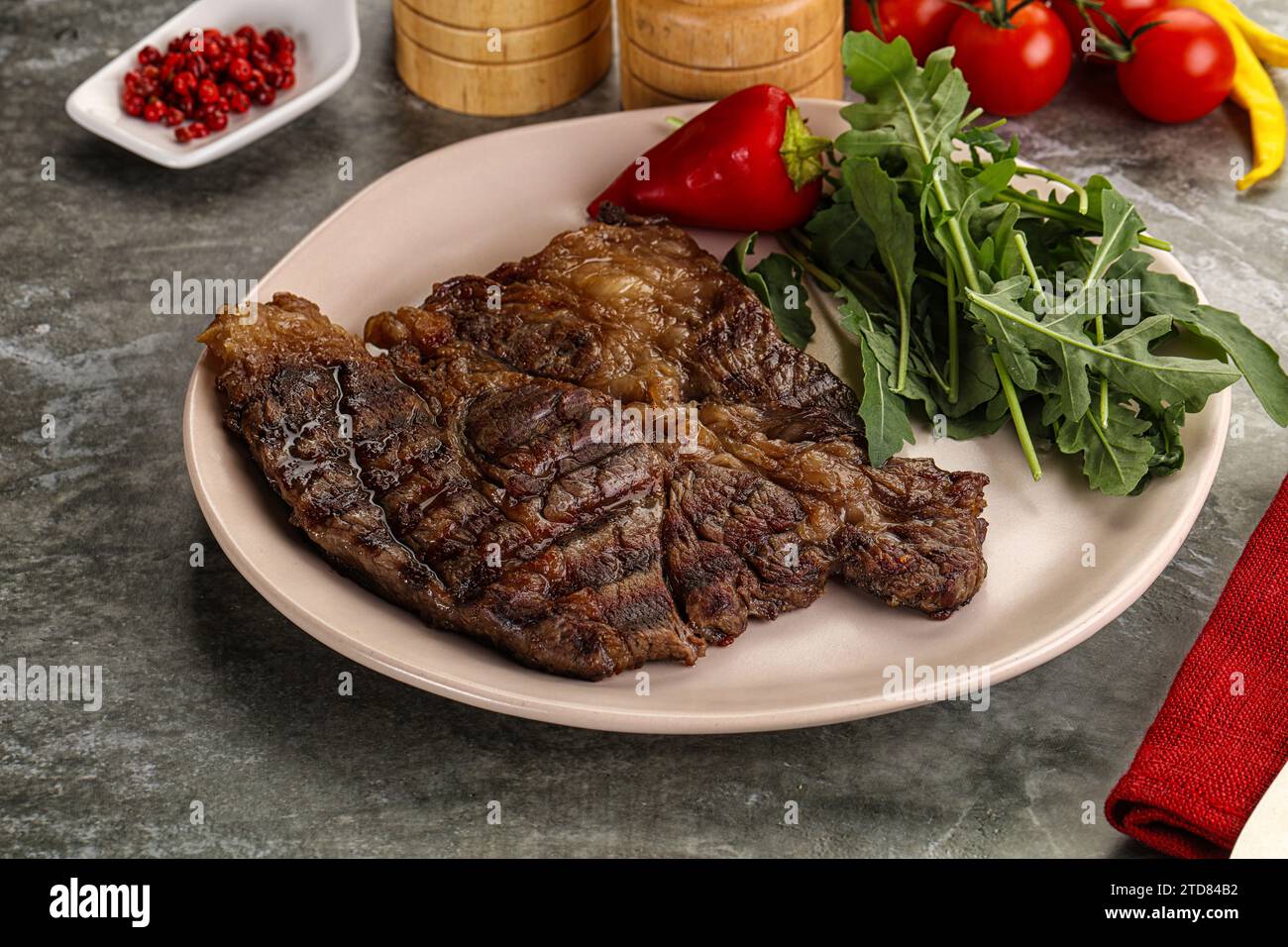 Grilled chuck roll beef steak with arugula Stock Photo - Alamy