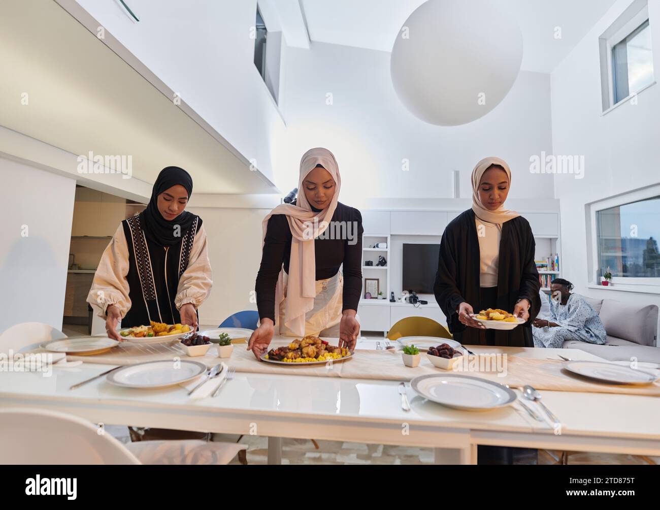 Group of young Arab women come together to lovingly prepare an iftar ...