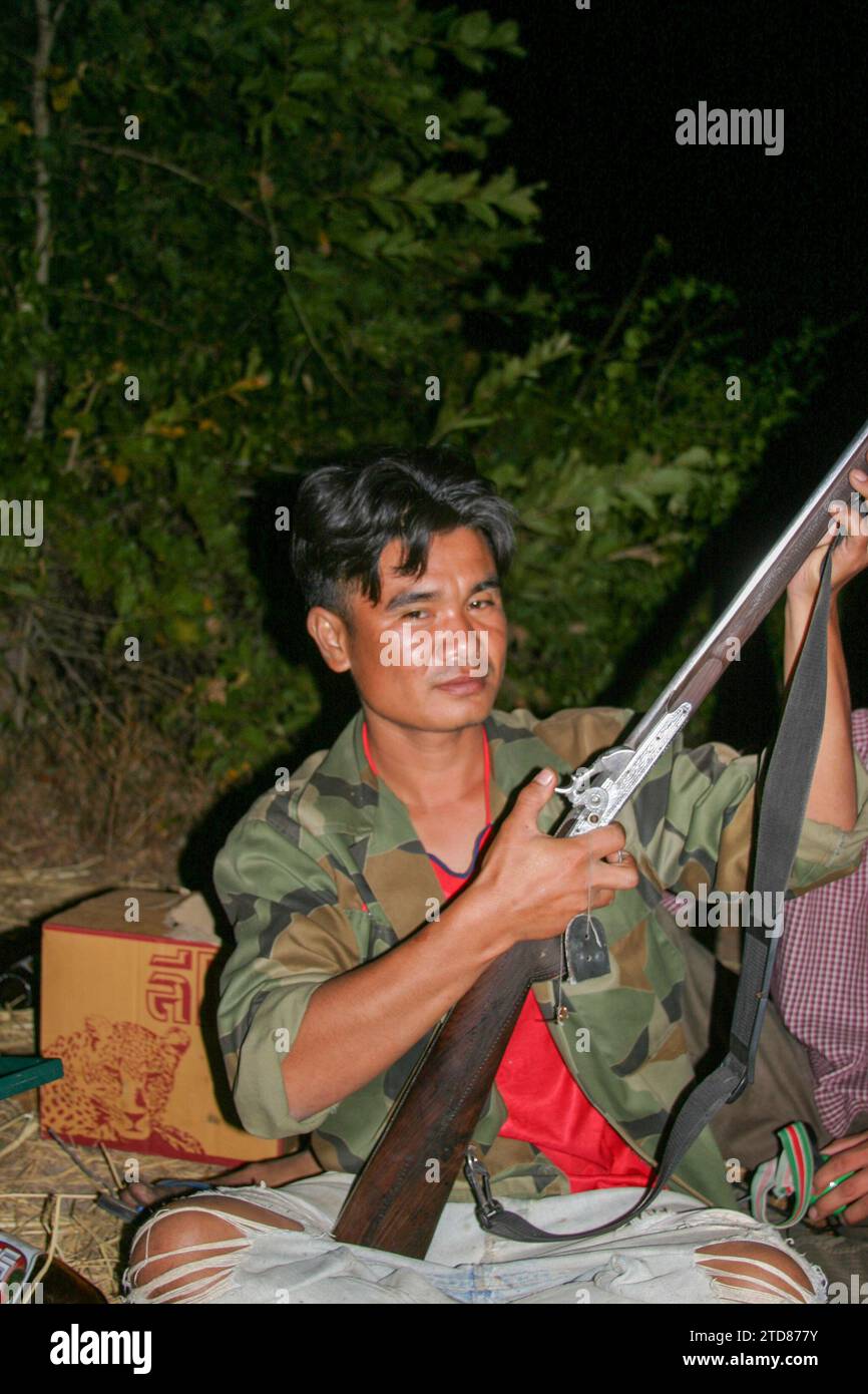 Thai hunters with rifle in Isan province Northern Thailand Stock Photo ...