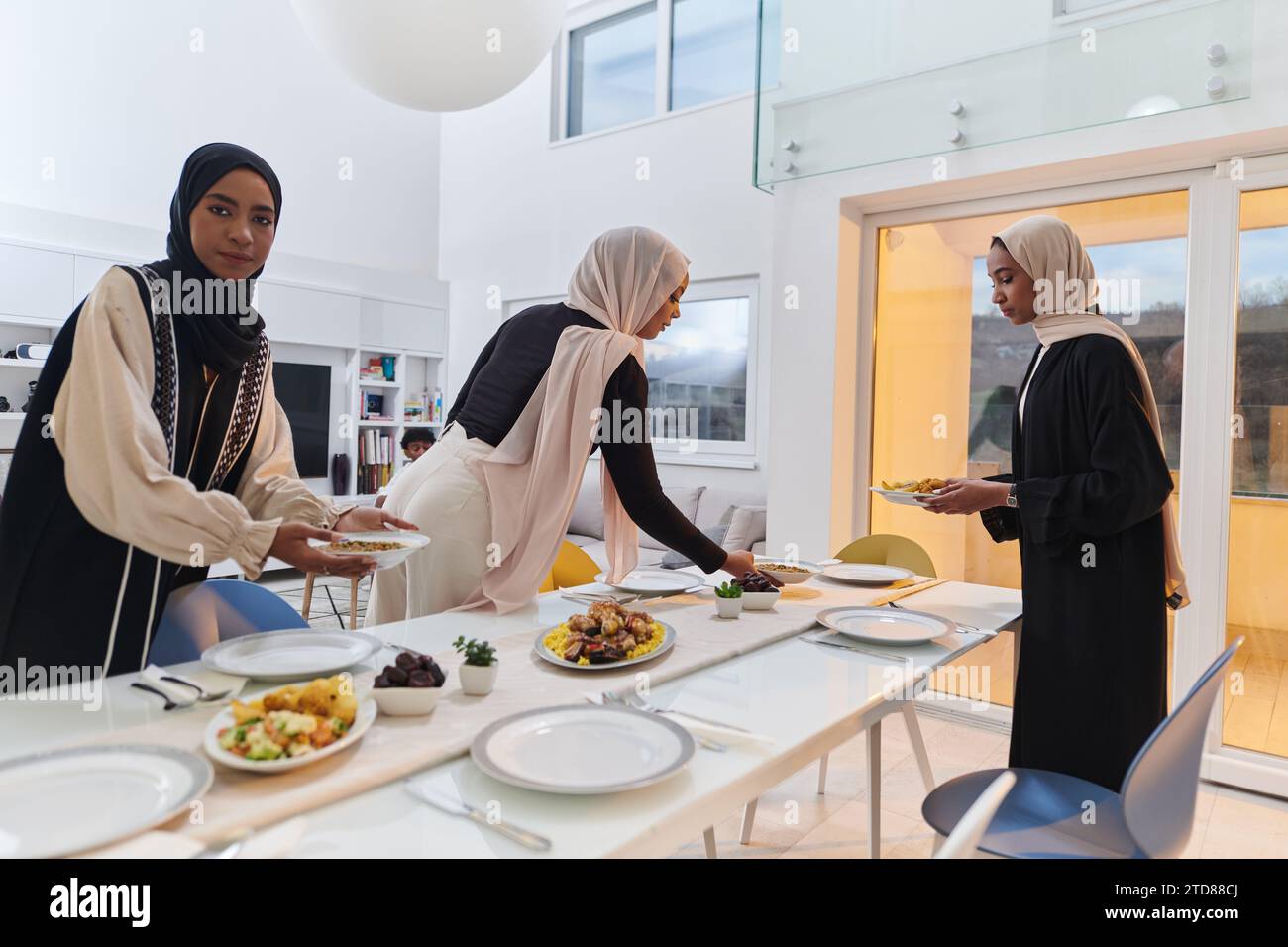 Group of young Arab women come together to lovingly prepare an iftar ...