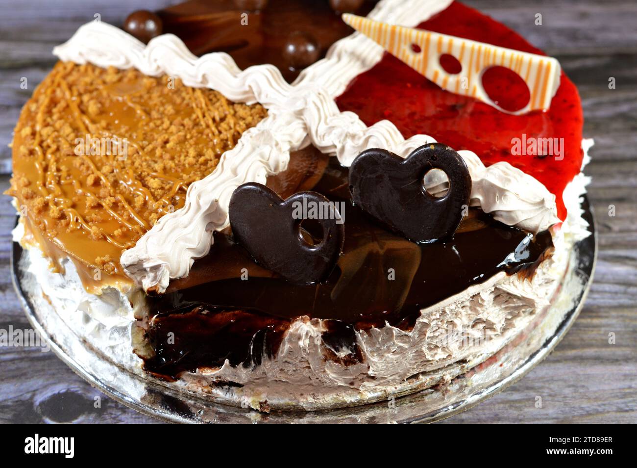 A birthday cake, four different quarters spongy creamy cake for ...