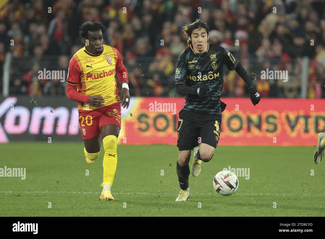 Junya Ito of Reims, left Faitout Maouassa of Lens during the French championship Ligue 1 ...