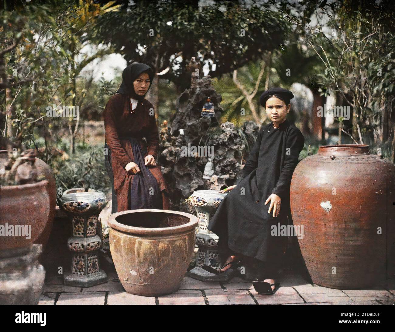 Tonkin, Indochina Two young girls from a wealthy family sitting in a ...
