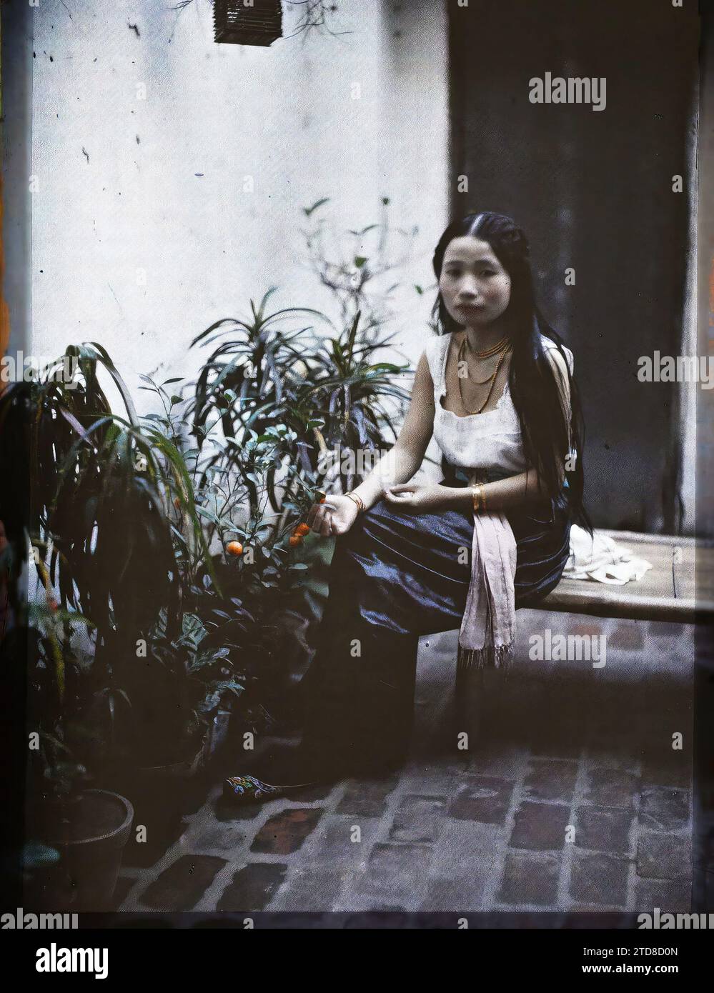 Tonkin, Indochina An elegant young upper-class woman in a camisole, her ...