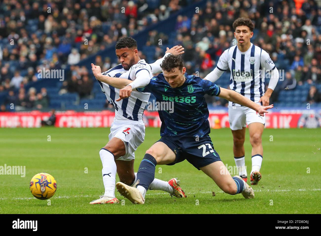 Darnell Furlong #2 of West Bromwich Albion is tackled by Luke McNally ...