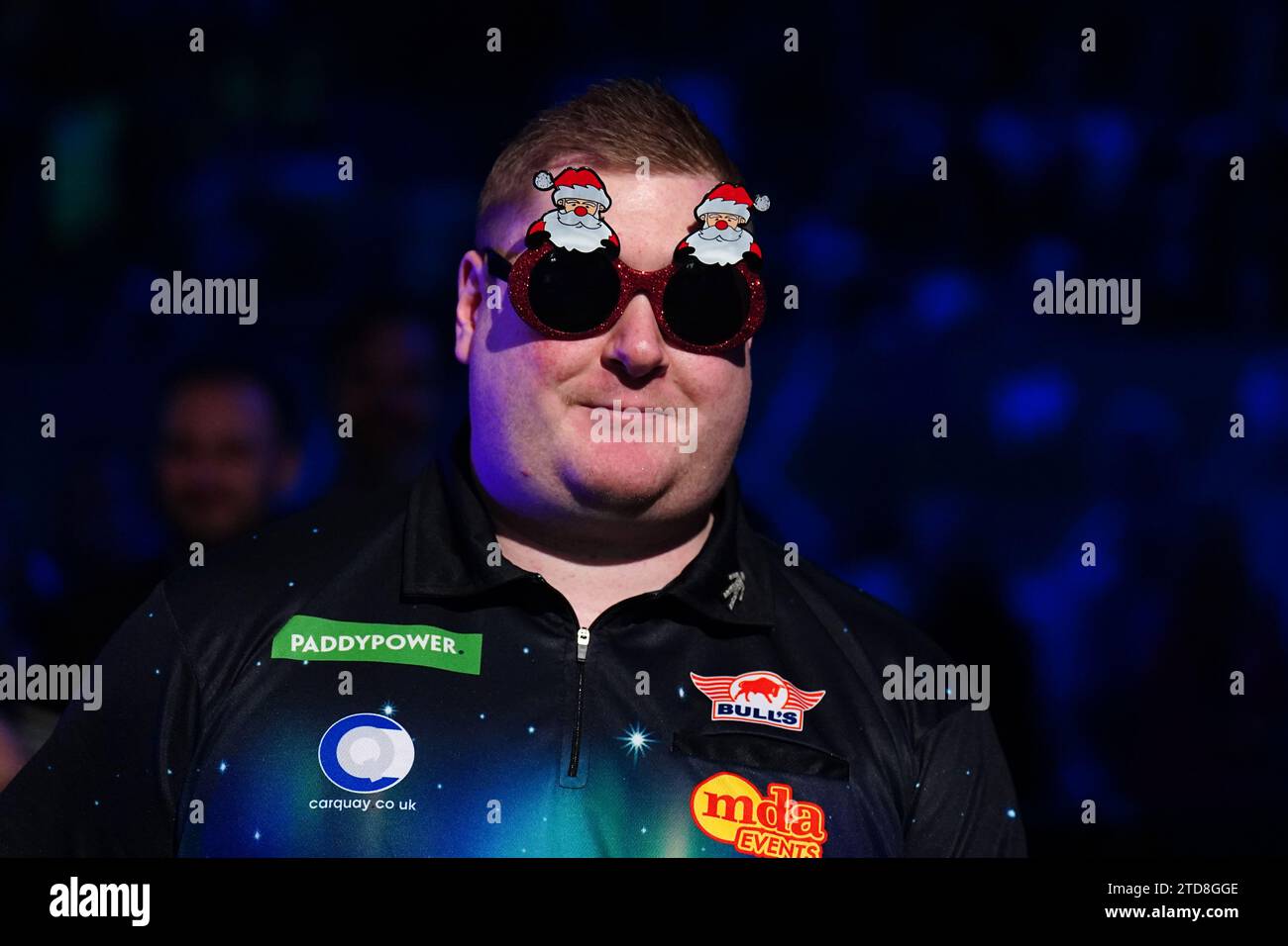 Ricky Evans walks out to play Simon Adams (not pictured) on day three ...