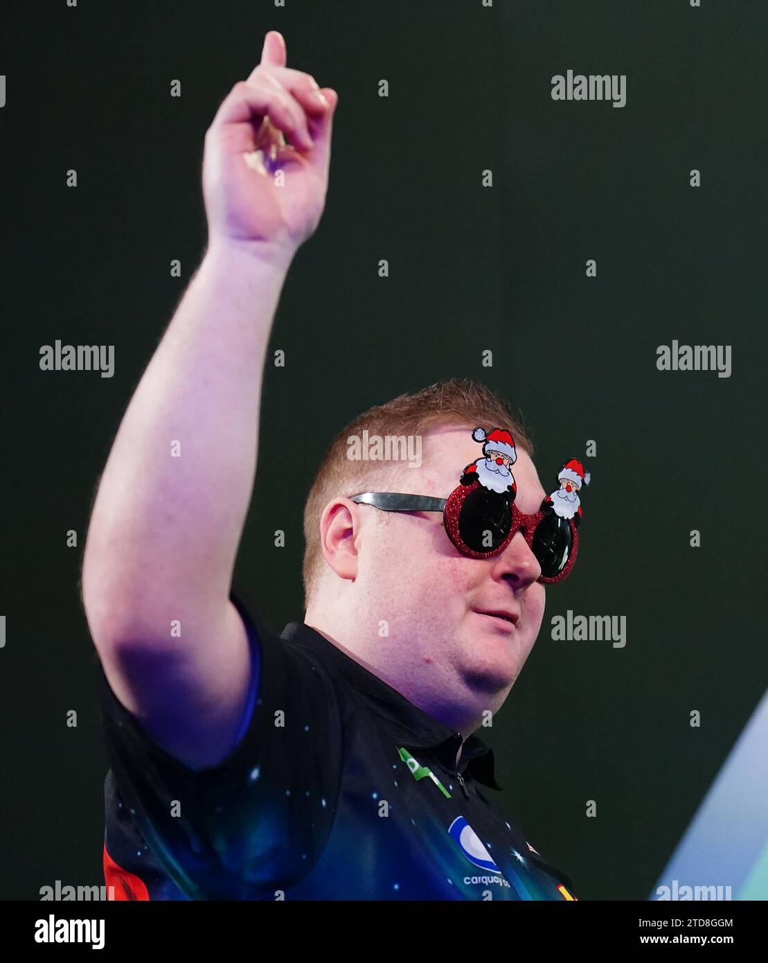 Ricky Evans walks out to play Simon Adams (not pictured) on day three ...