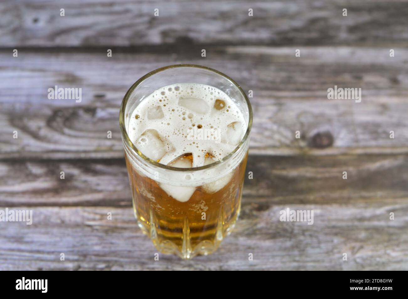 Apple malt drink in a glass with ice cubes, natural and refreshing ...