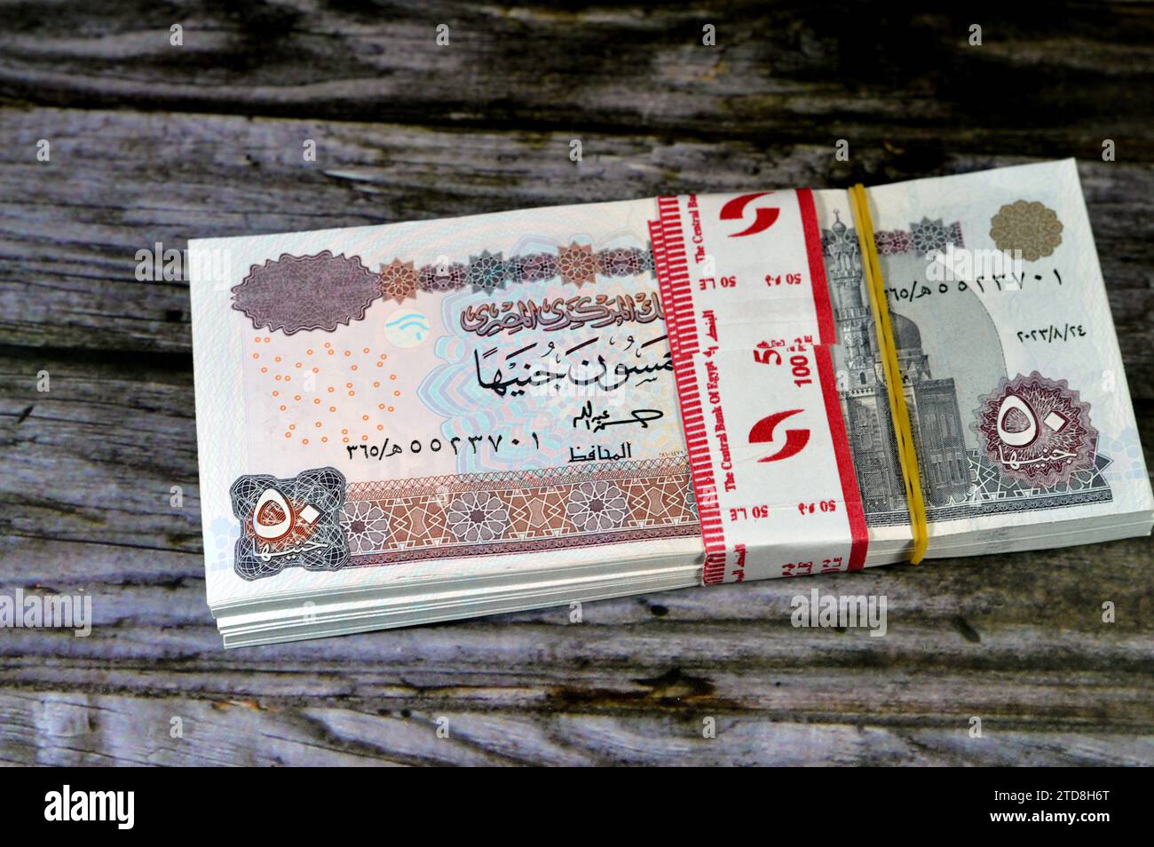 Egypt money stack of pounds isolated on wood background, pile of 50 EGP ...