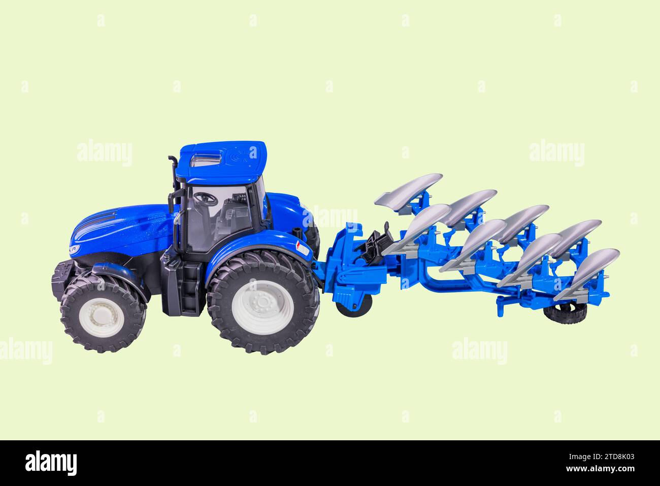 Close-up view of a radio-controlled model of a toy farm tractor with a ...