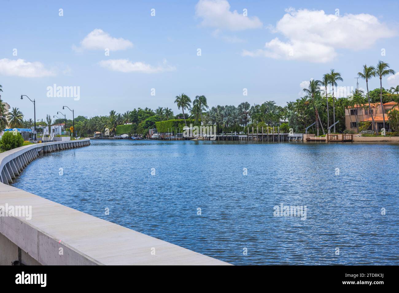Scenic waterfront promenade in Miami Beach with luxury villas, yacht ...