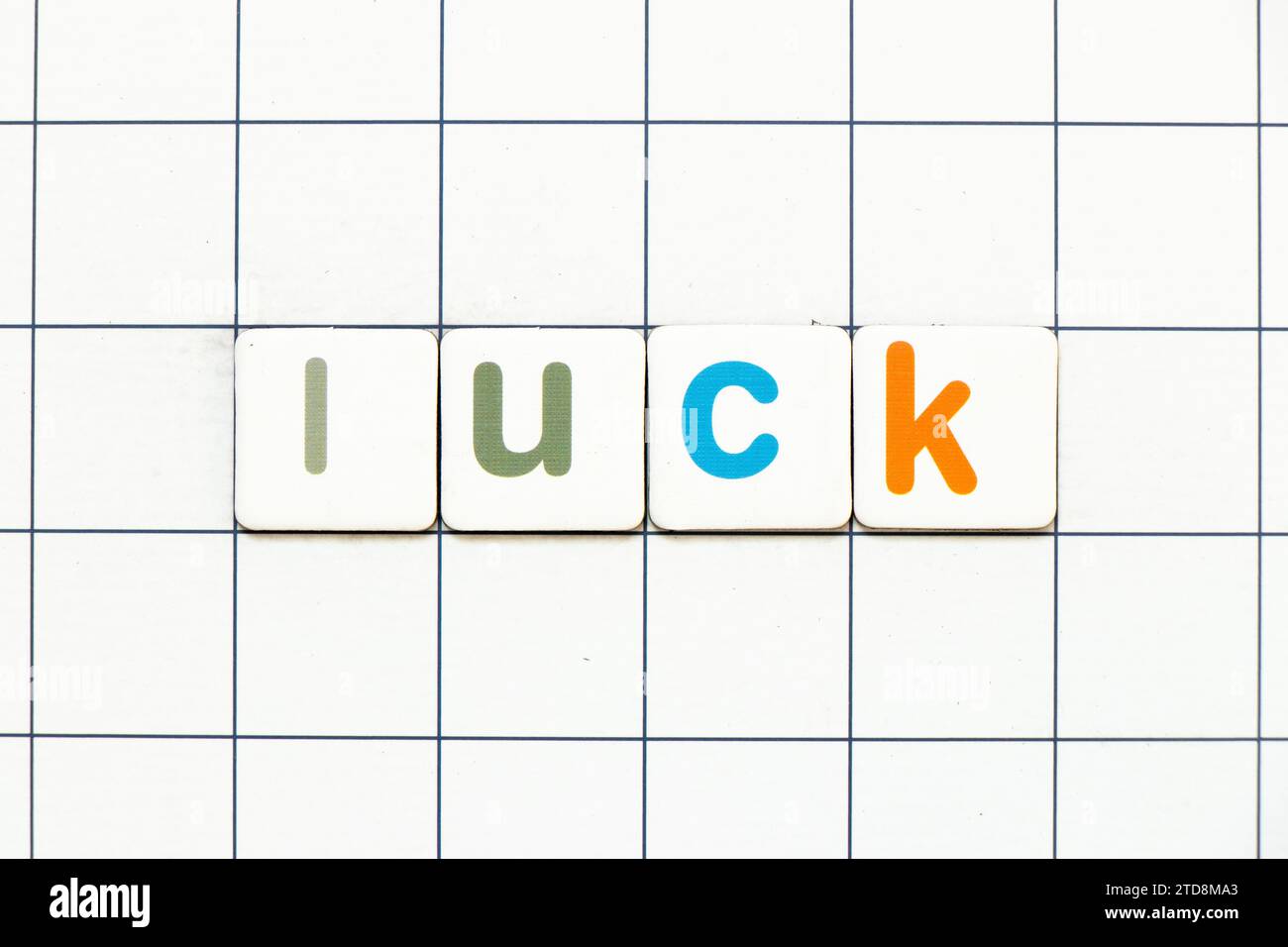 Colorful tile letter in word luck on white grid background Stock Photo ...