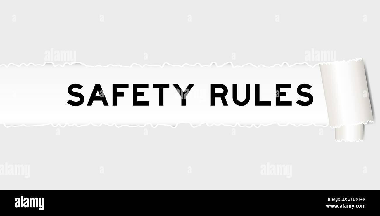 Ripped gray paper background that have word safety rules under torn ...