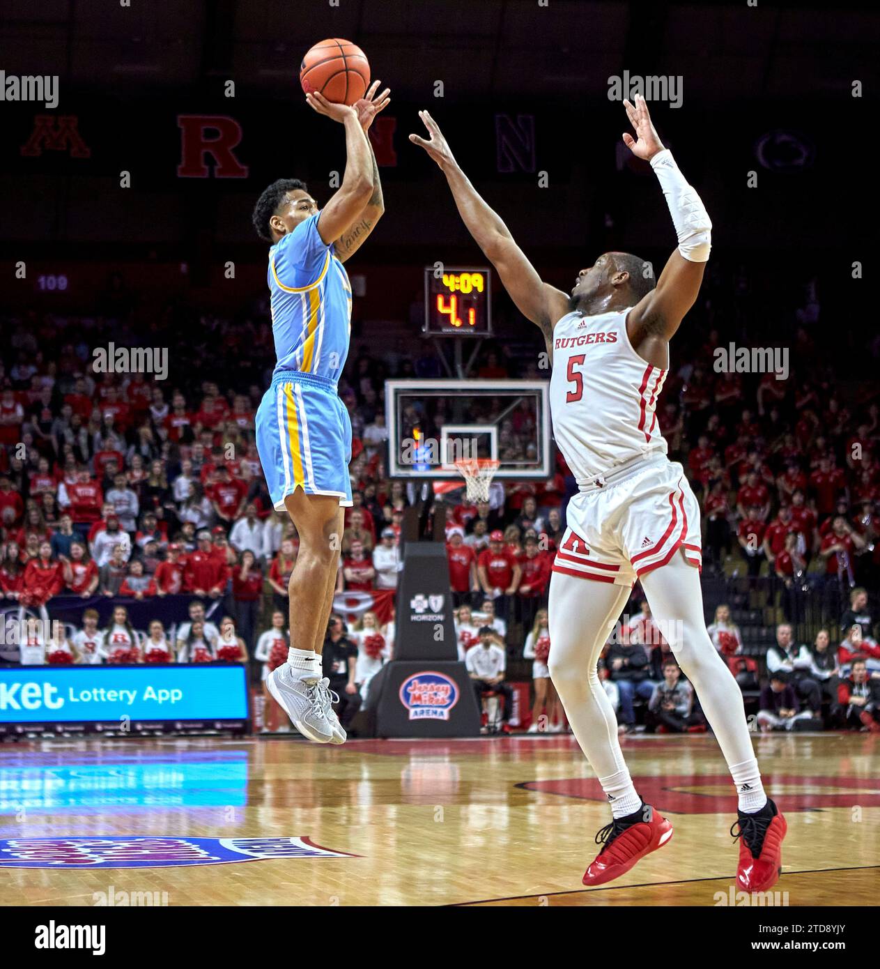 Long Island Sharks guard Andre Washington (5) shoots against Rutgers ...