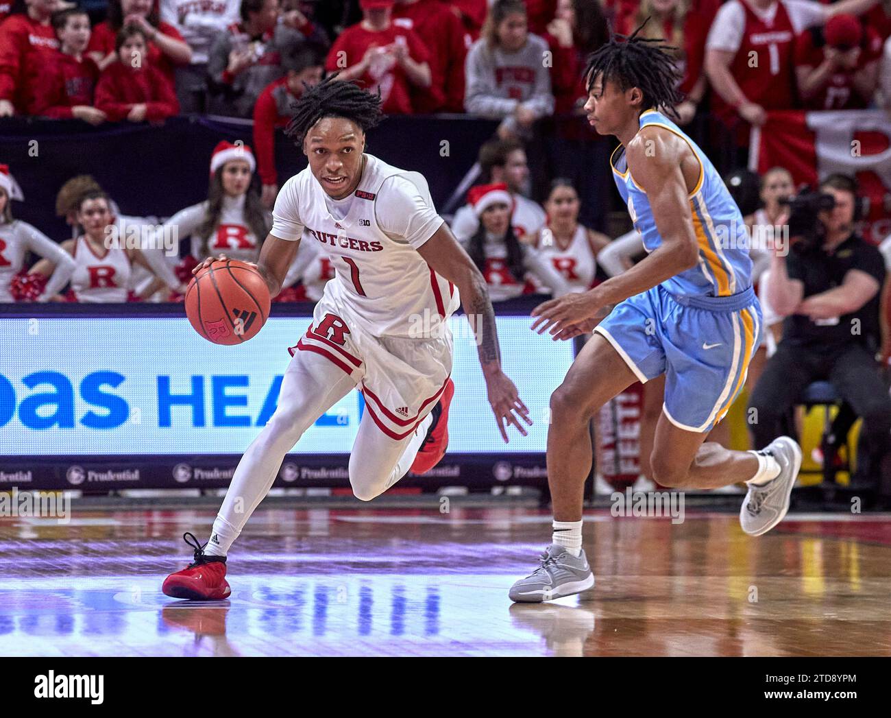 Rutgers Scarlet Knights guard Jamichael Davis (1) is defended by Long ...