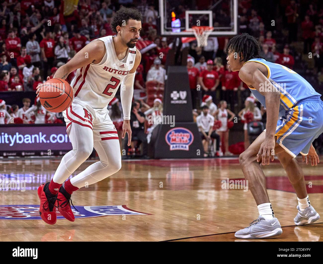 Rutgers Scarlet Knights guard Noah Fernandes (2) is defended by Long ...