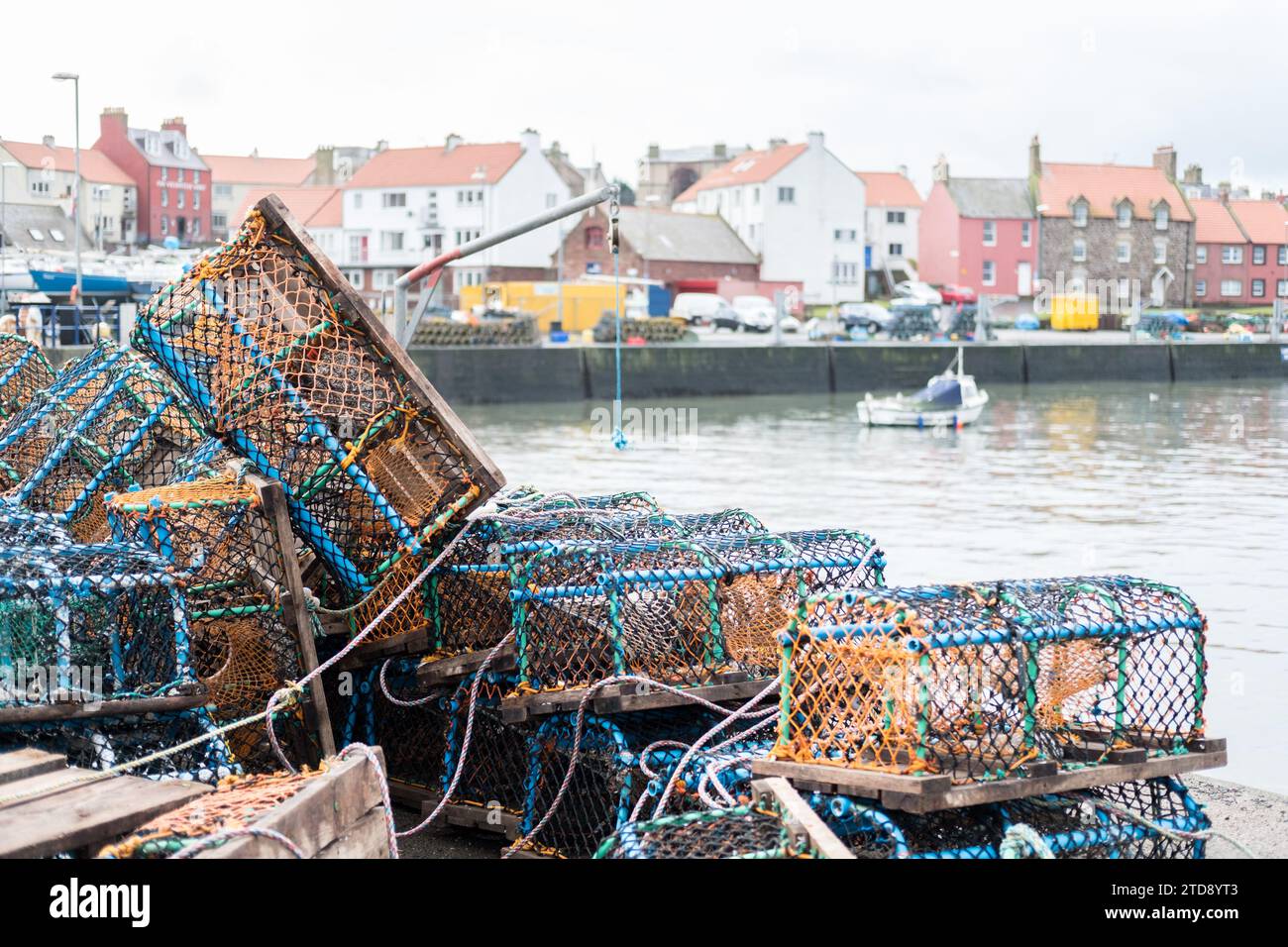 Group of fist net traps with building on the background Stock Photo - Alamy
