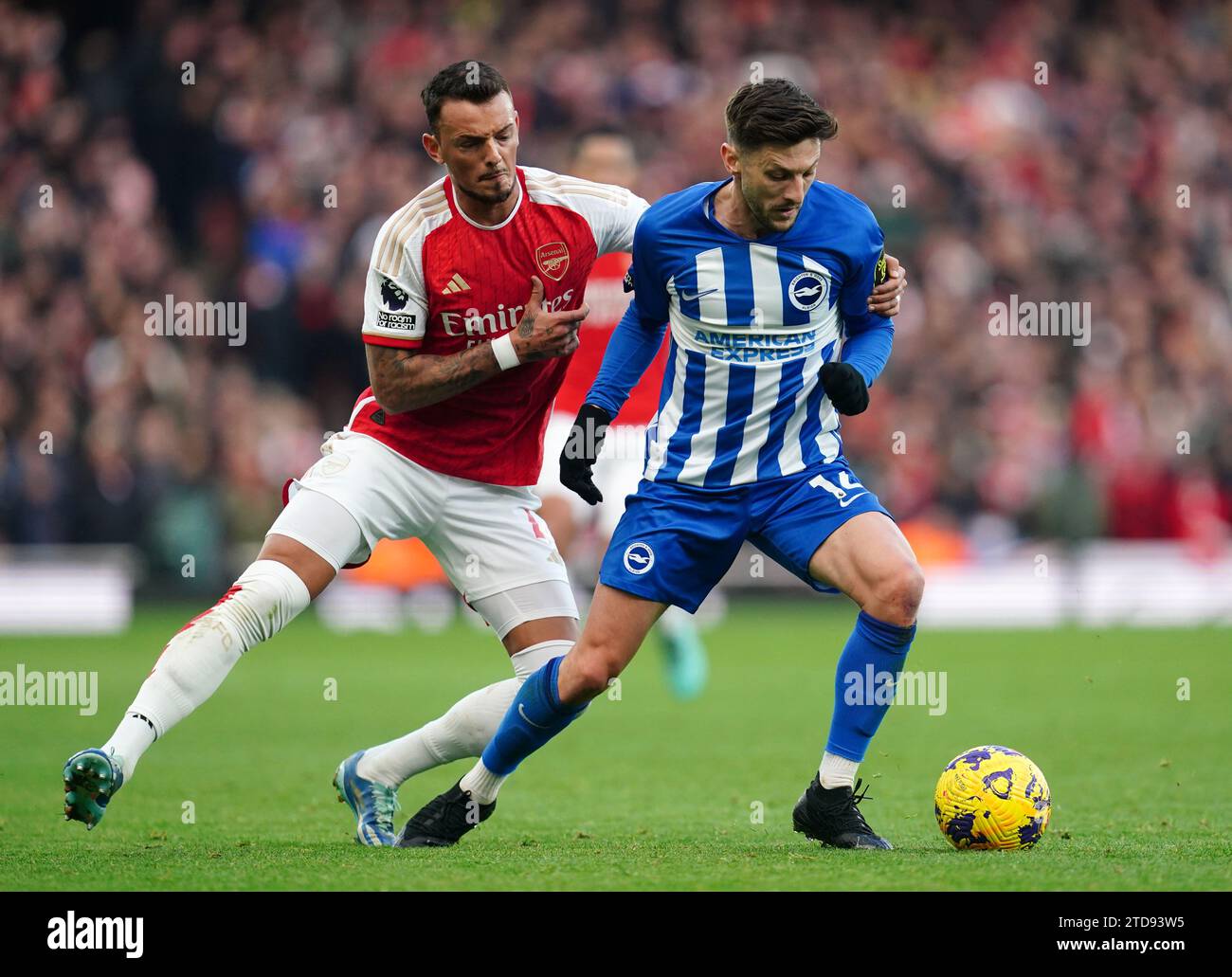 Arsenal's Ben White (left) and Brighton and Hove Albion's Adam Lallana ...