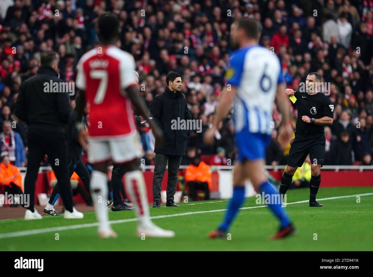 Arsenal manager Mikel Arteta is shown a yellow card by referee Tim ...
